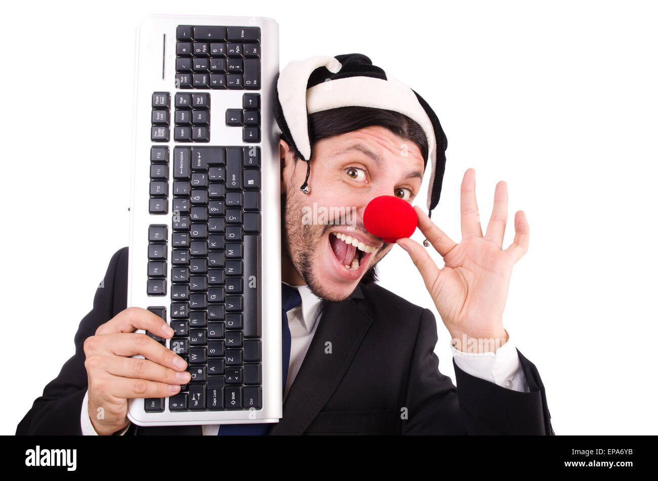Funny clown with keyboard isolated on white Stock Photo - Alamy