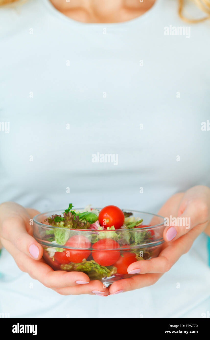 Woman diet concept portrait. Female model eating green salad Stock ...