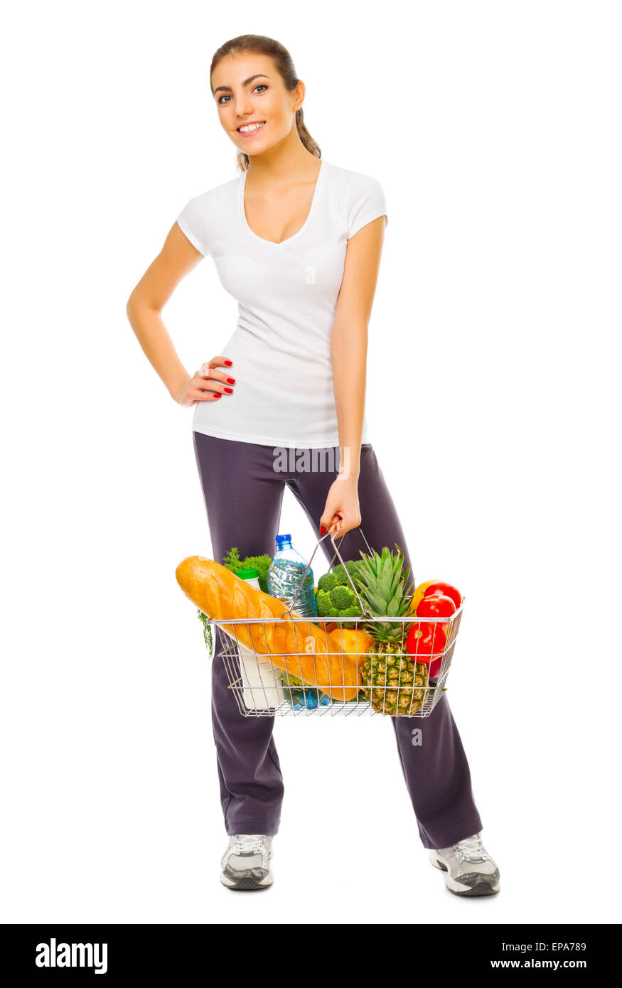 Young girl with full shop basket isolated Stock Photo - Alamy