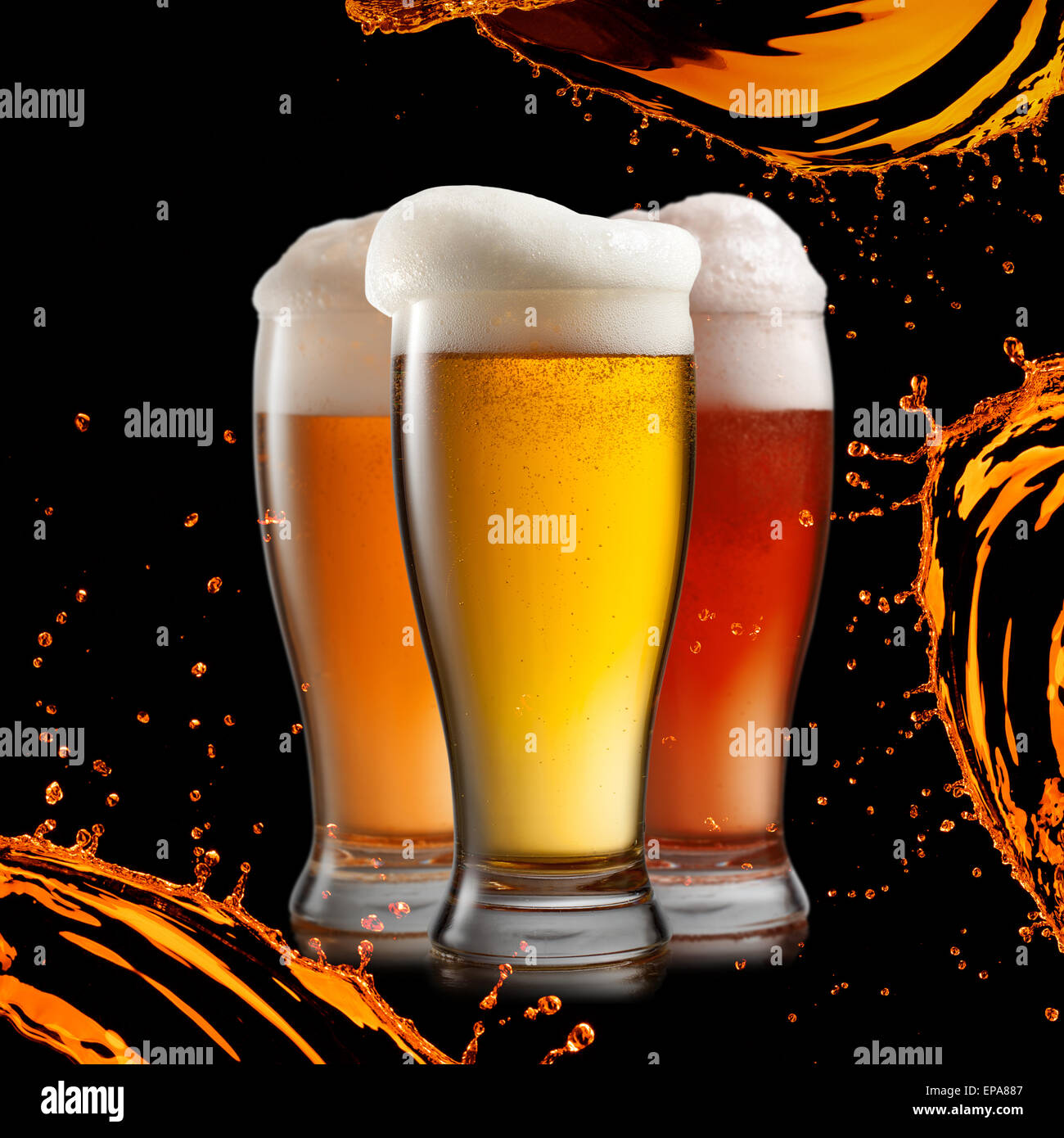 Different beer in glasses wish splash isolated on black background ...