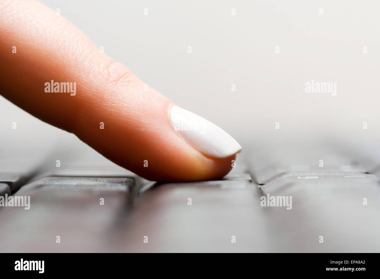 Female finger typing on computer keyboard Stock Photo - Alamy