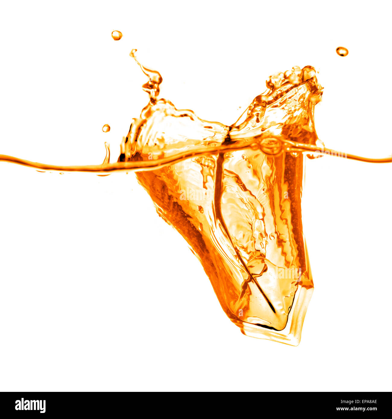 ice cubes dropped into orange water with splash isolated on white Stock Photo - Alamy