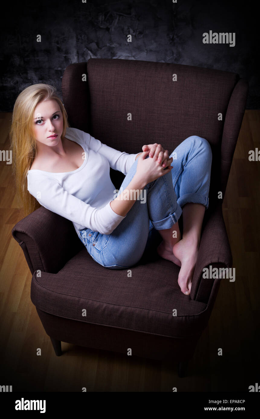 Portrait of young girl in chair Stock Photo - Alamy