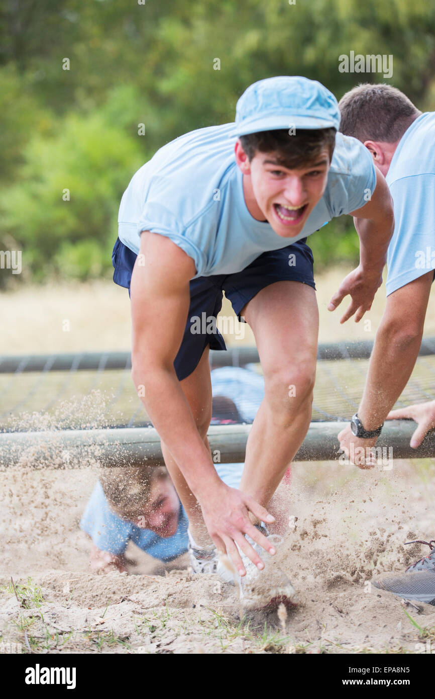 man running boot camp obstacle course Stock Photo - Alamy