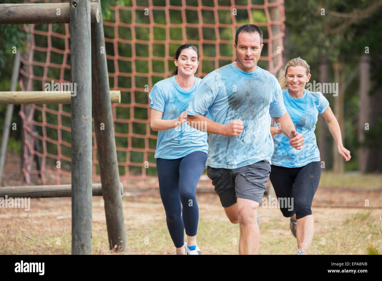 team running boot camp obstacle course Stock Photo - Alamy