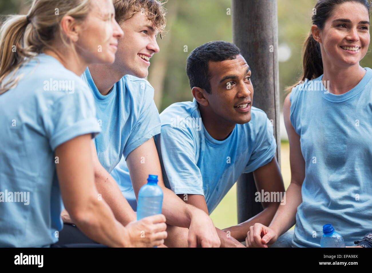 tired team resting drinking water boot camp Stock Photo - Alamy
