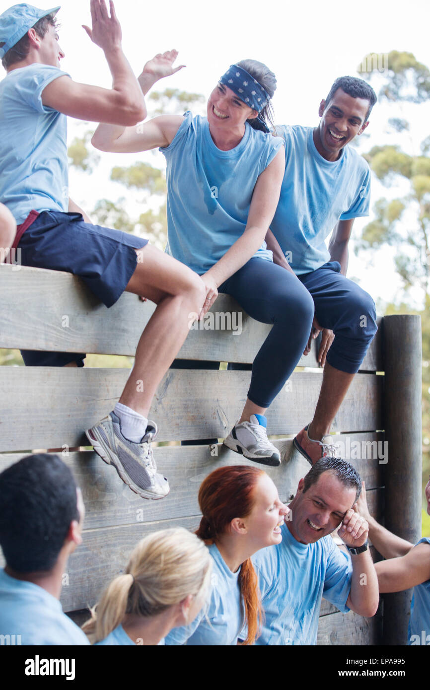 team celebration wall boot camp obstacle course Stock Photo - Alamy
