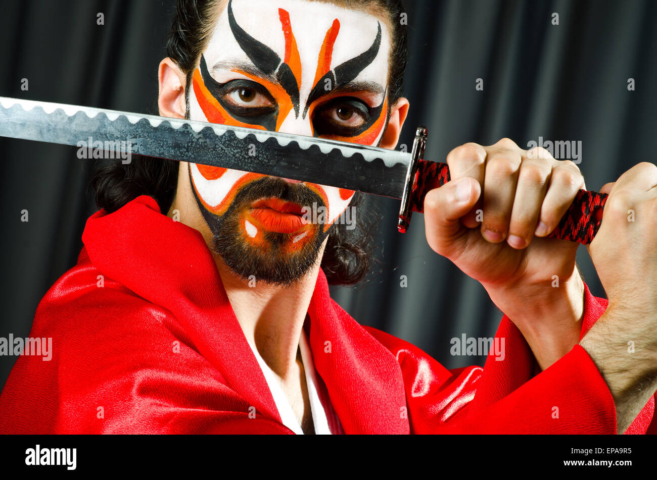 Man with sword and face mask Stock Photo - Alamy