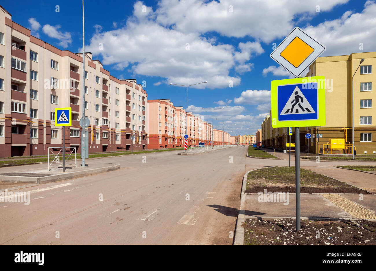 Traffic signs main road and pedestrian crossing with apartment ...