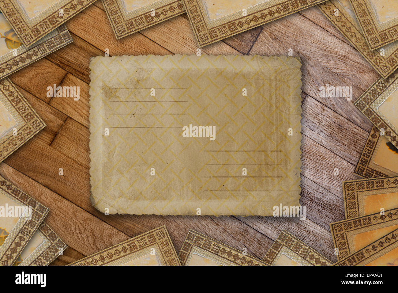 A stack of old postcards and frames on a wooden table Stock Photo - Alamy