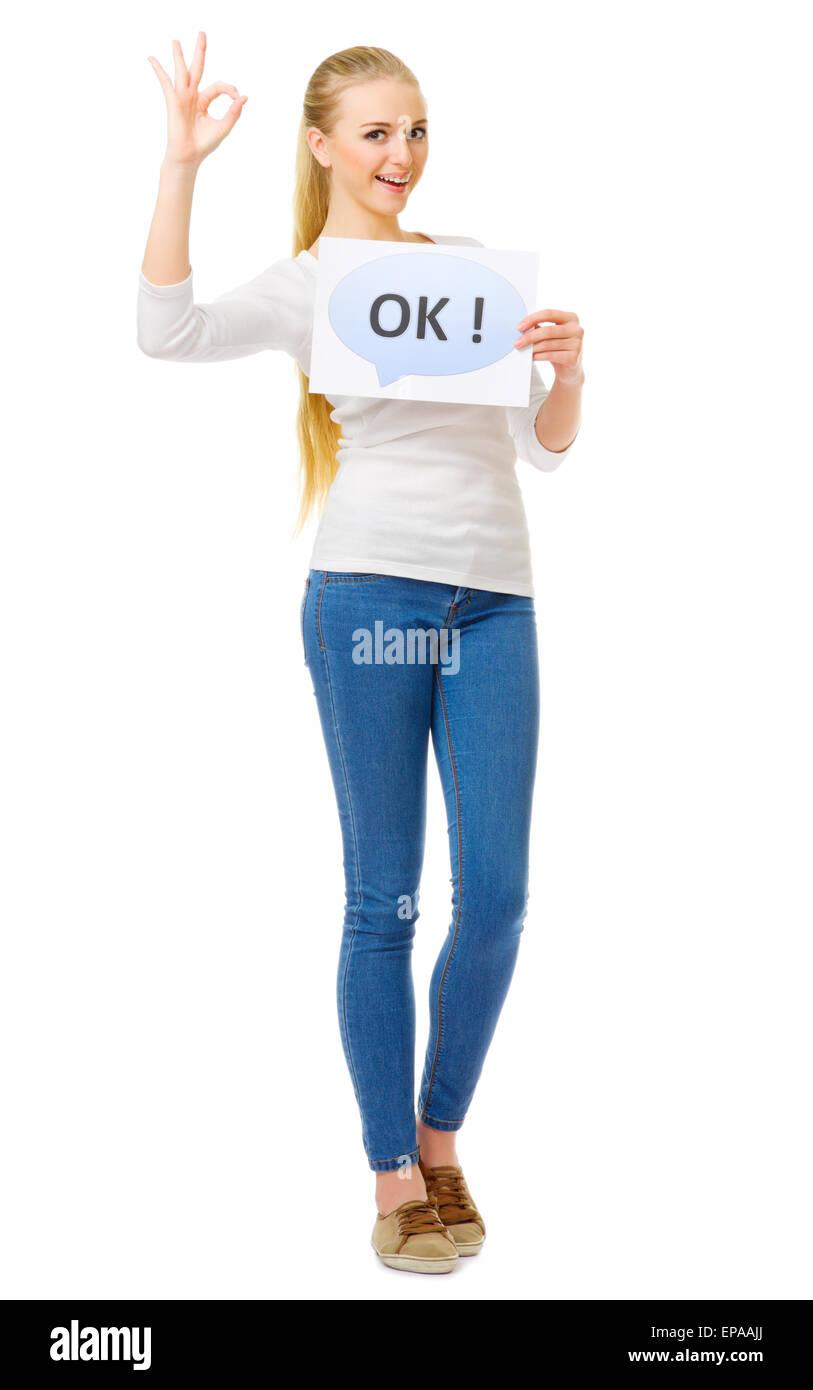 Young girl in blue jeans with Ok placard isolated Stock Photo - Alamy