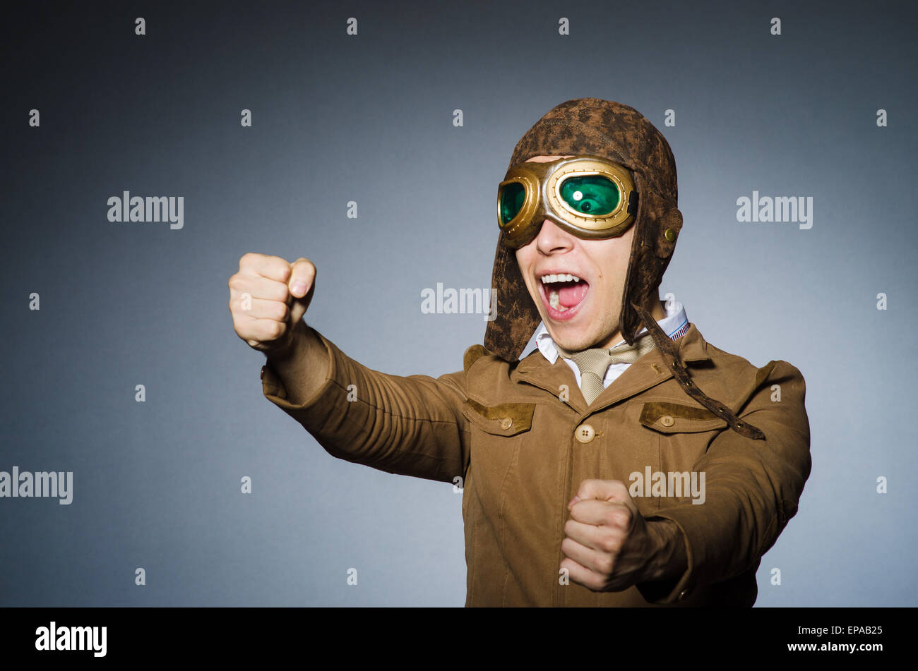 Funny pilot with goggles and helmet Stock Photo - Alamy