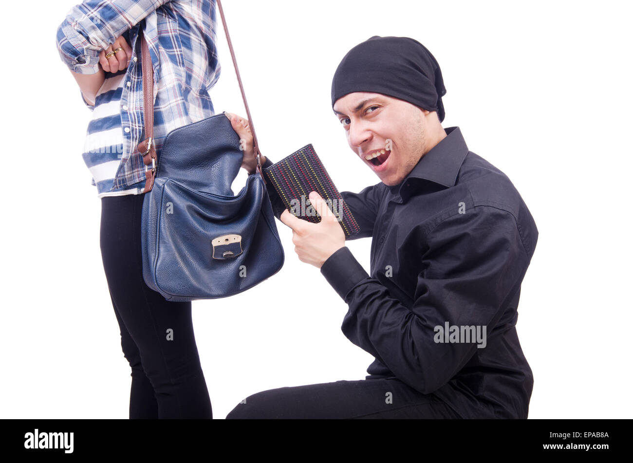 Young thief stealing woman's bag Stock Photo - Alamy