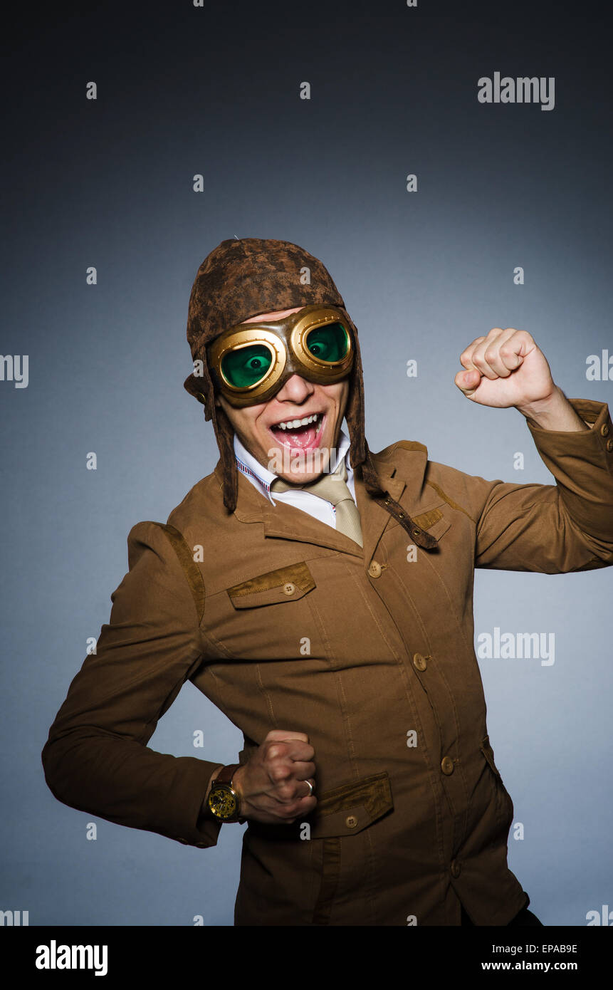 Funny pilot with goggles and helmet Stock Photo - Alamy