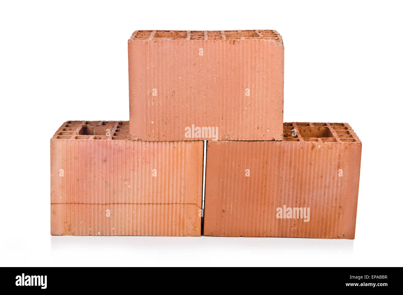 Stack of clay bricks isolated on white Stock Photo - Alamy