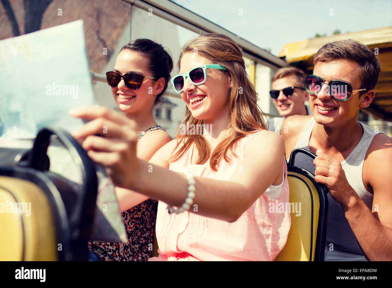 group of smiling friends traveling by tour bus Stock Photo - Alamy
