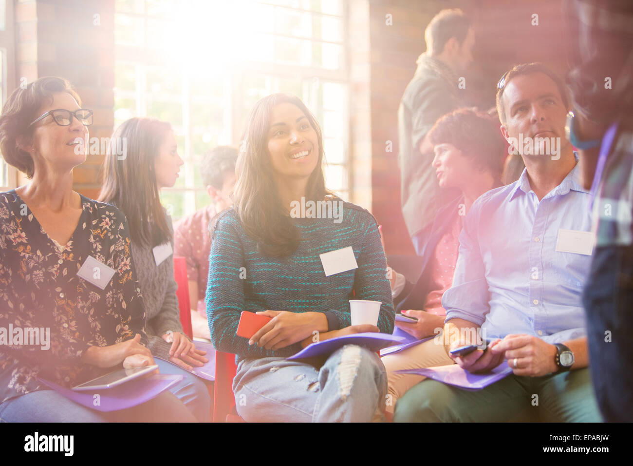 smiling people talking Community center Stock Photo - Alamy