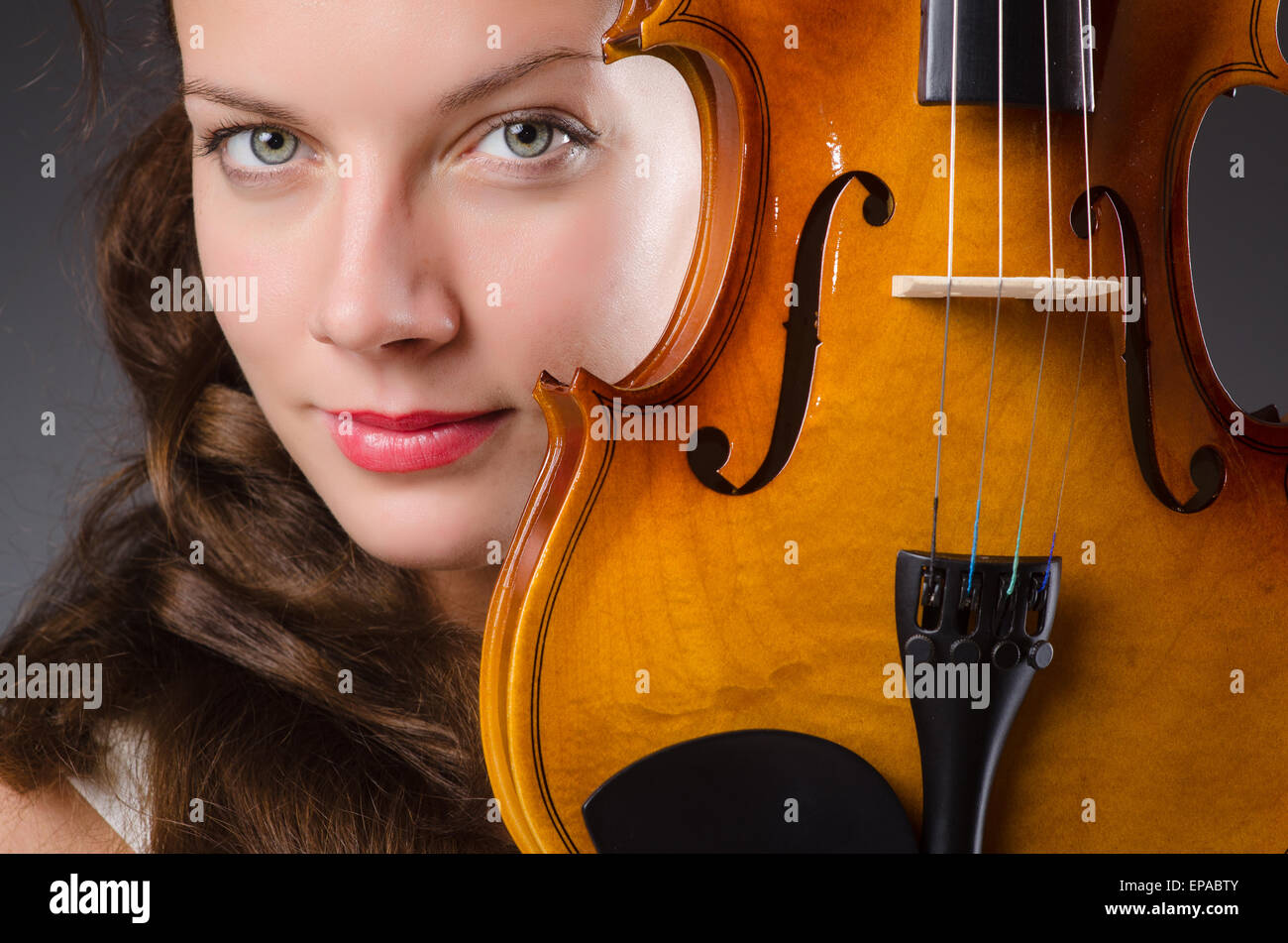 Woman artist with violin in music concept Stock Photo - Alamy