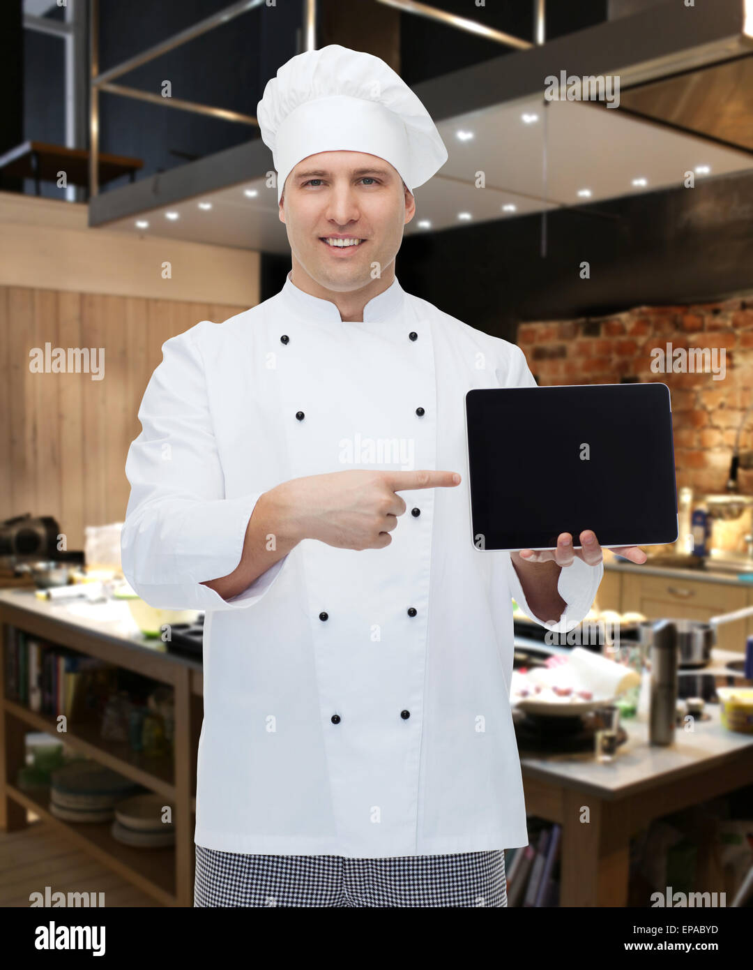 happy male chef cook showing with tablet pc Stock Photo - Alamy