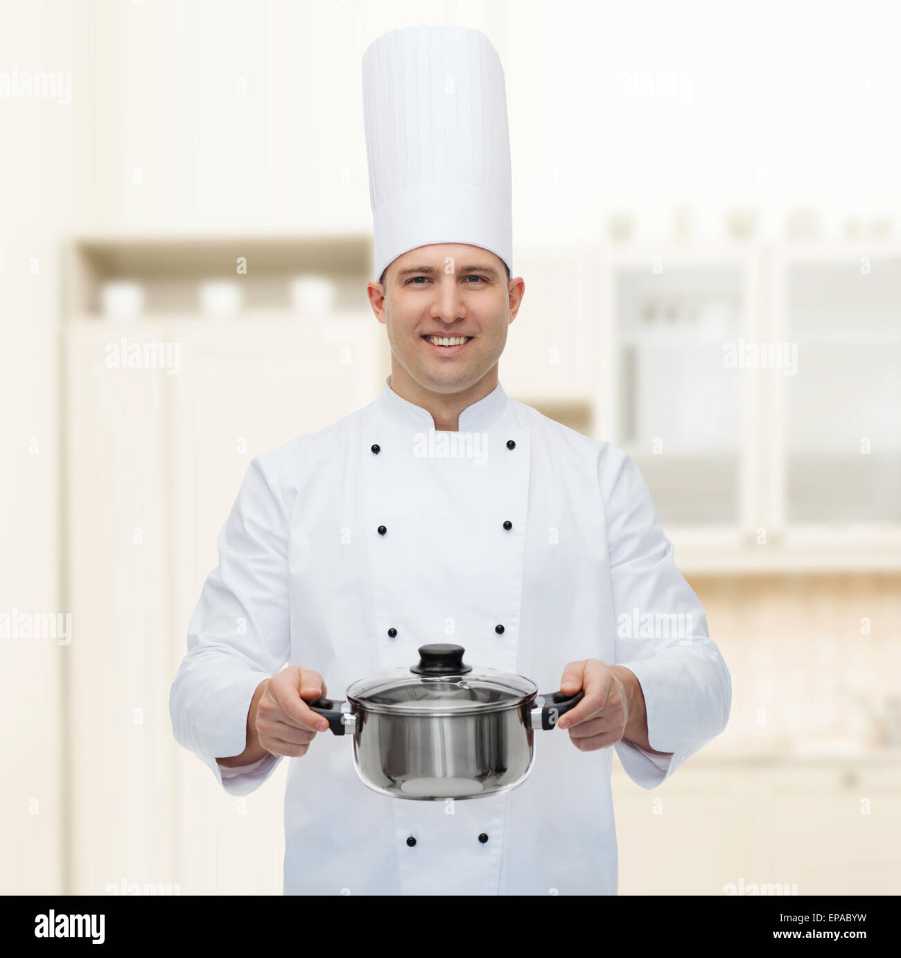 happy male chef cook holding pot Stock Photo - Alamy
