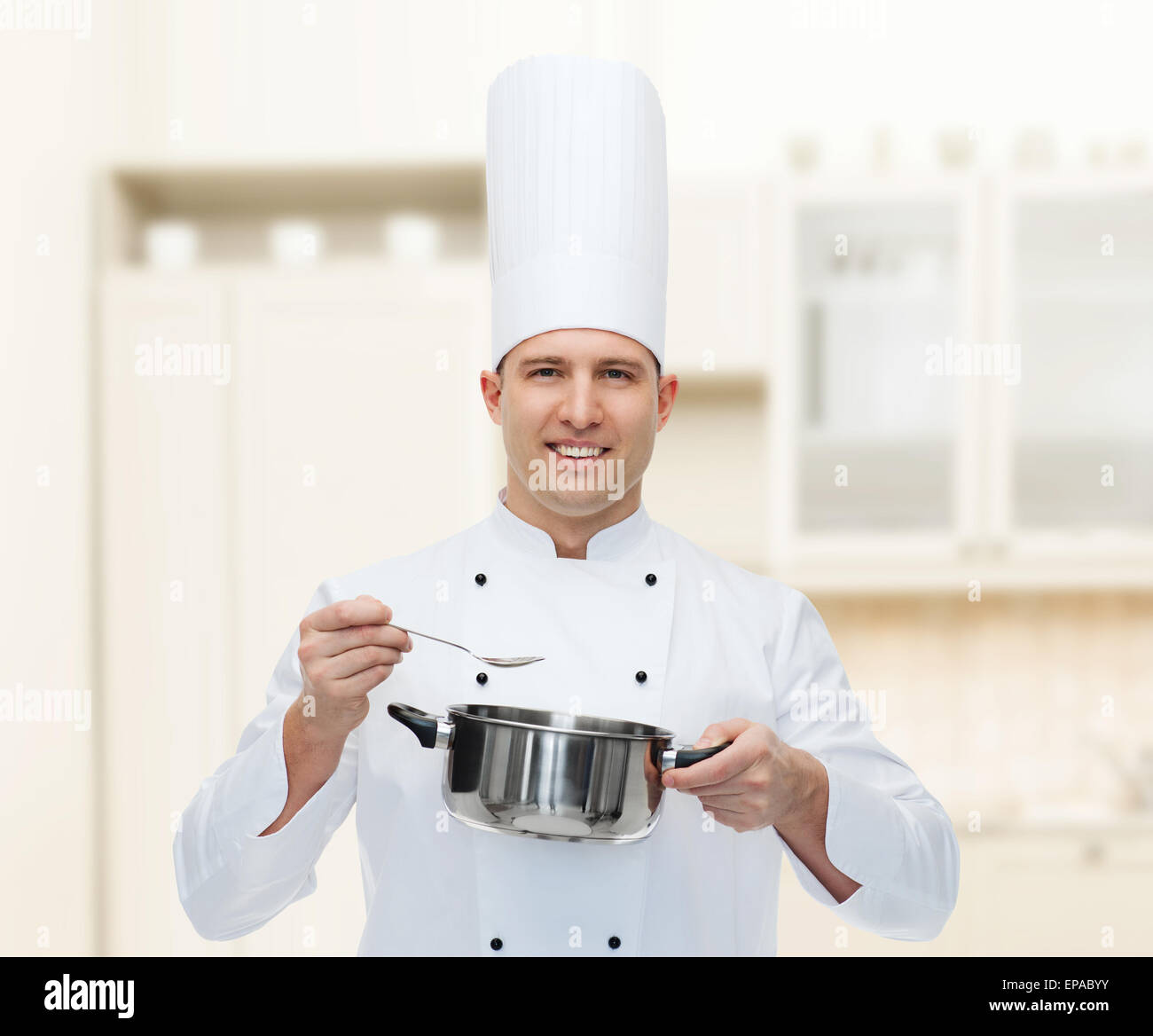 happy male chef cook with pot and spoon Stock Photo - Alamy