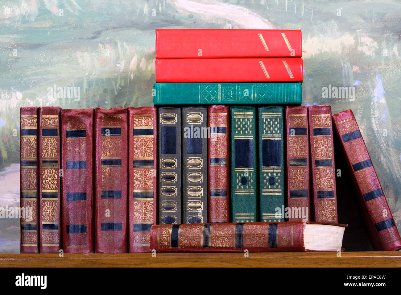 Richly decorated volumes of books with a gold lettering on the ...