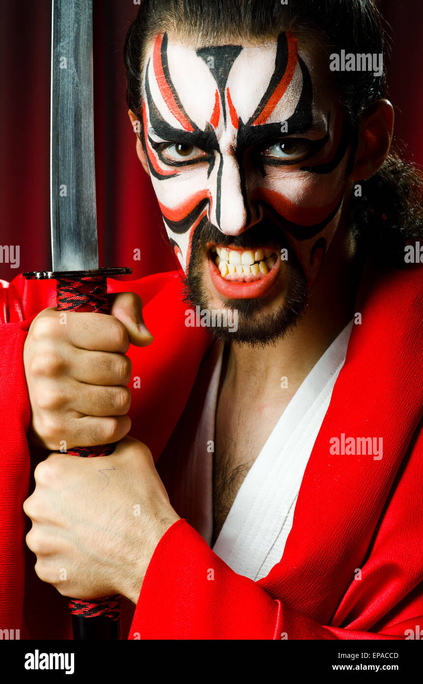 Man with sword and face mask Stock Photo - Alamy