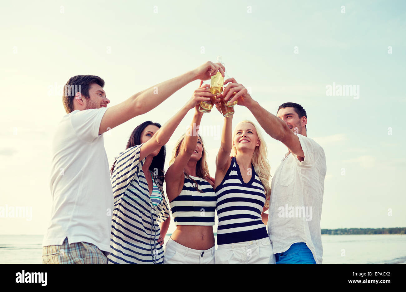 Couple clinking bottles hi-res stock photography and images - Alamy