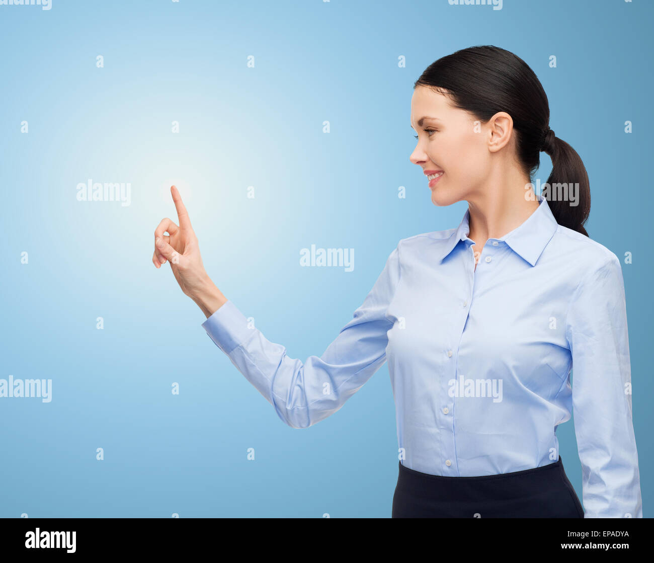 businesswoman touching something imaginary Stock Photo - Alamy
