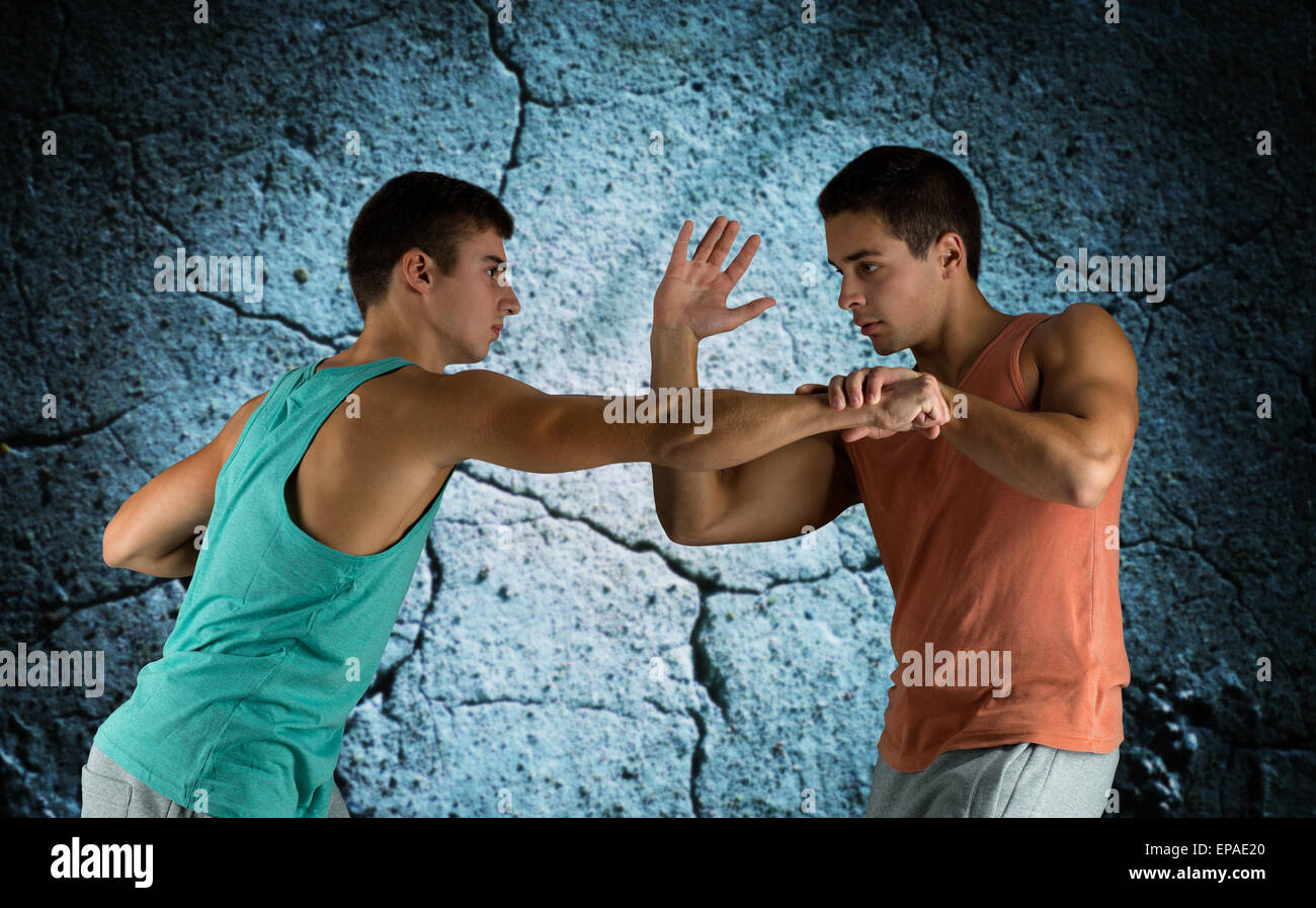 young men fighting hand-to-hand Stock Photo - Alamy