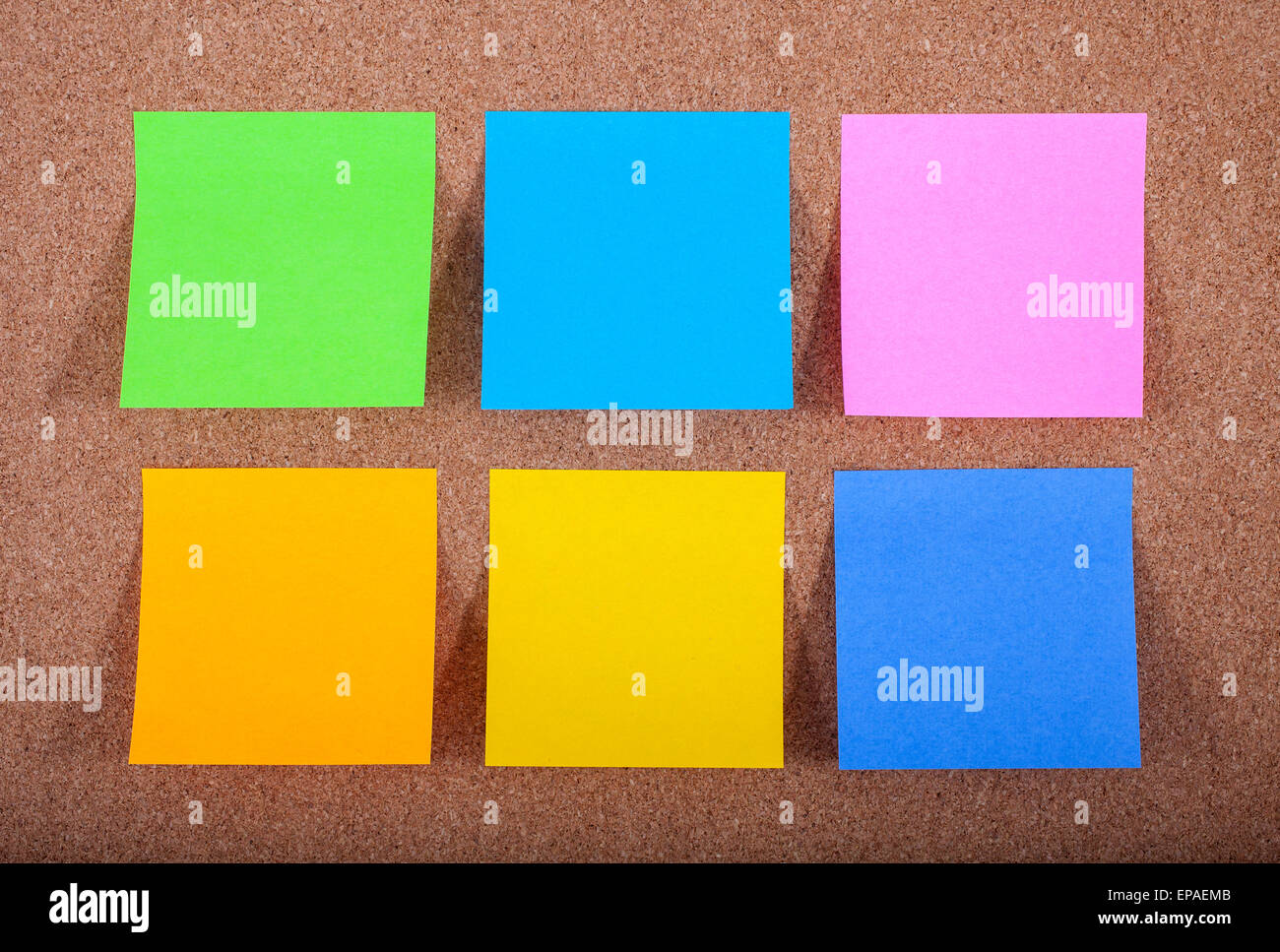 Six blank sticky notes on a noticeboard Stock Photo - Alamy