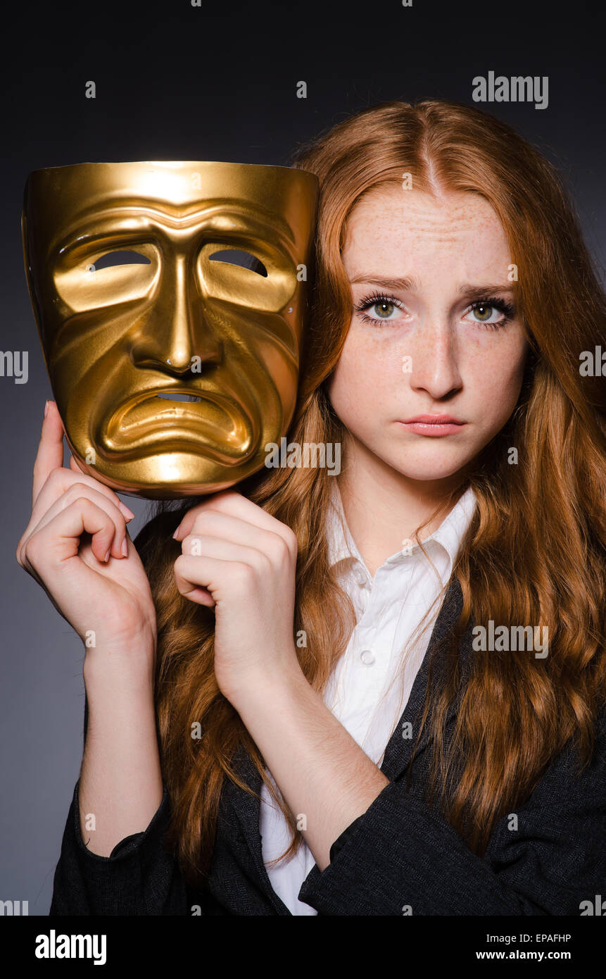Woman with mask in hypocrisy concept Stock Photo - Alamy