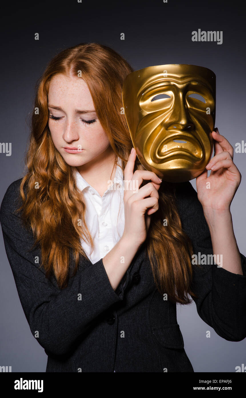 Woman with mask in hypocrisy concept Stock Photo - Alamy