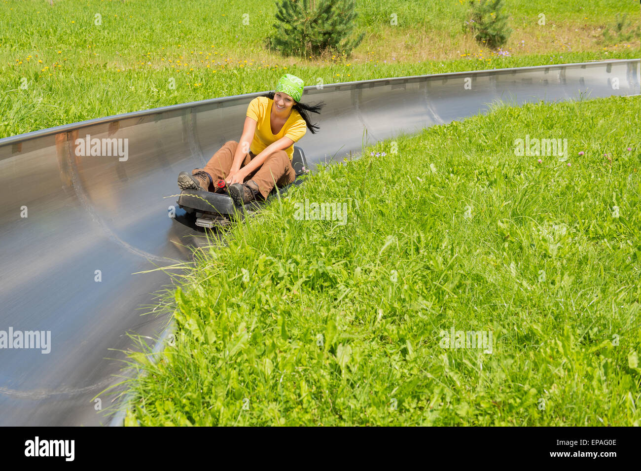 Woman Enjoying Summer Sledge Stock Photo - Alamy
