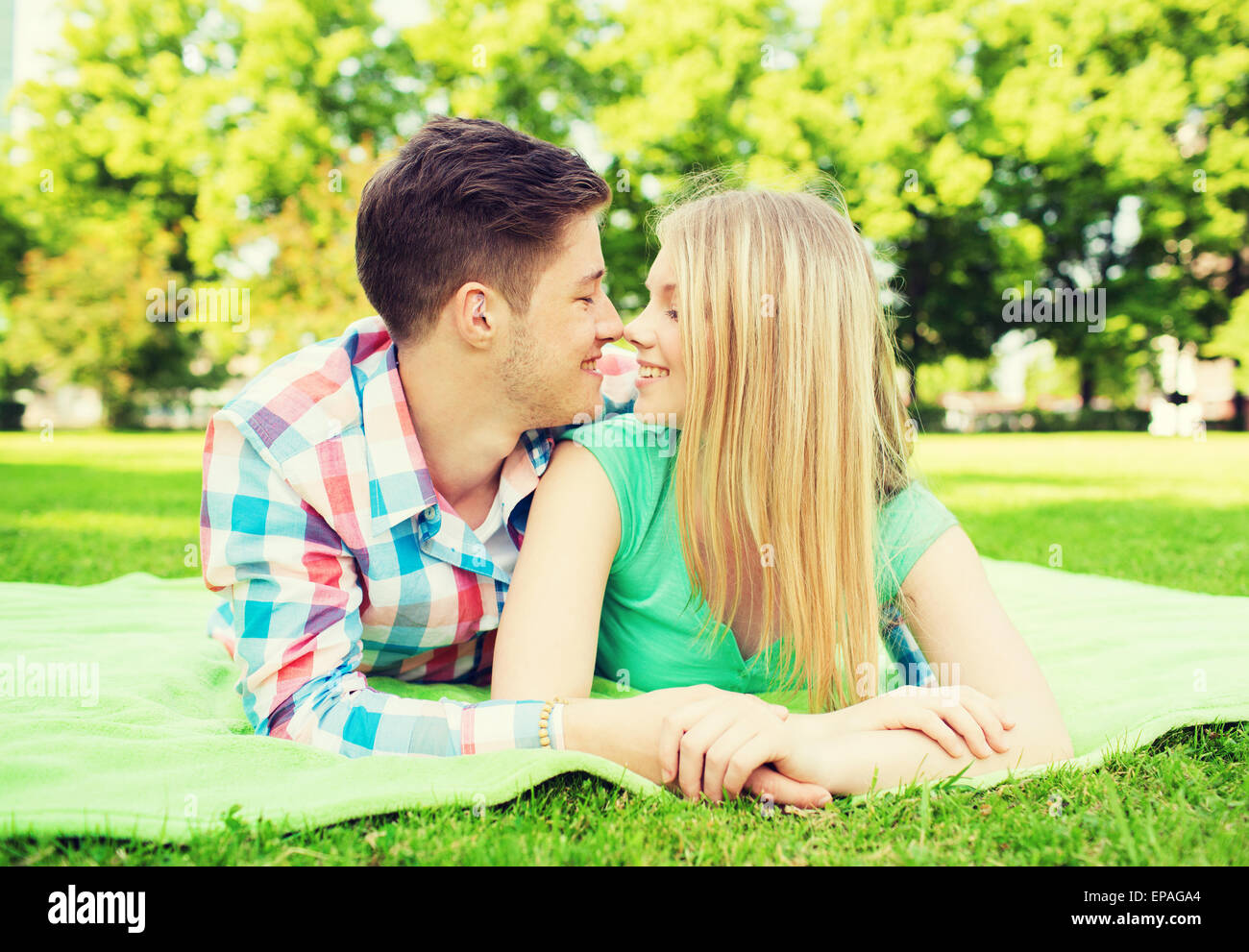 Smiling friends couple park summer hi-res stock photography and images ...