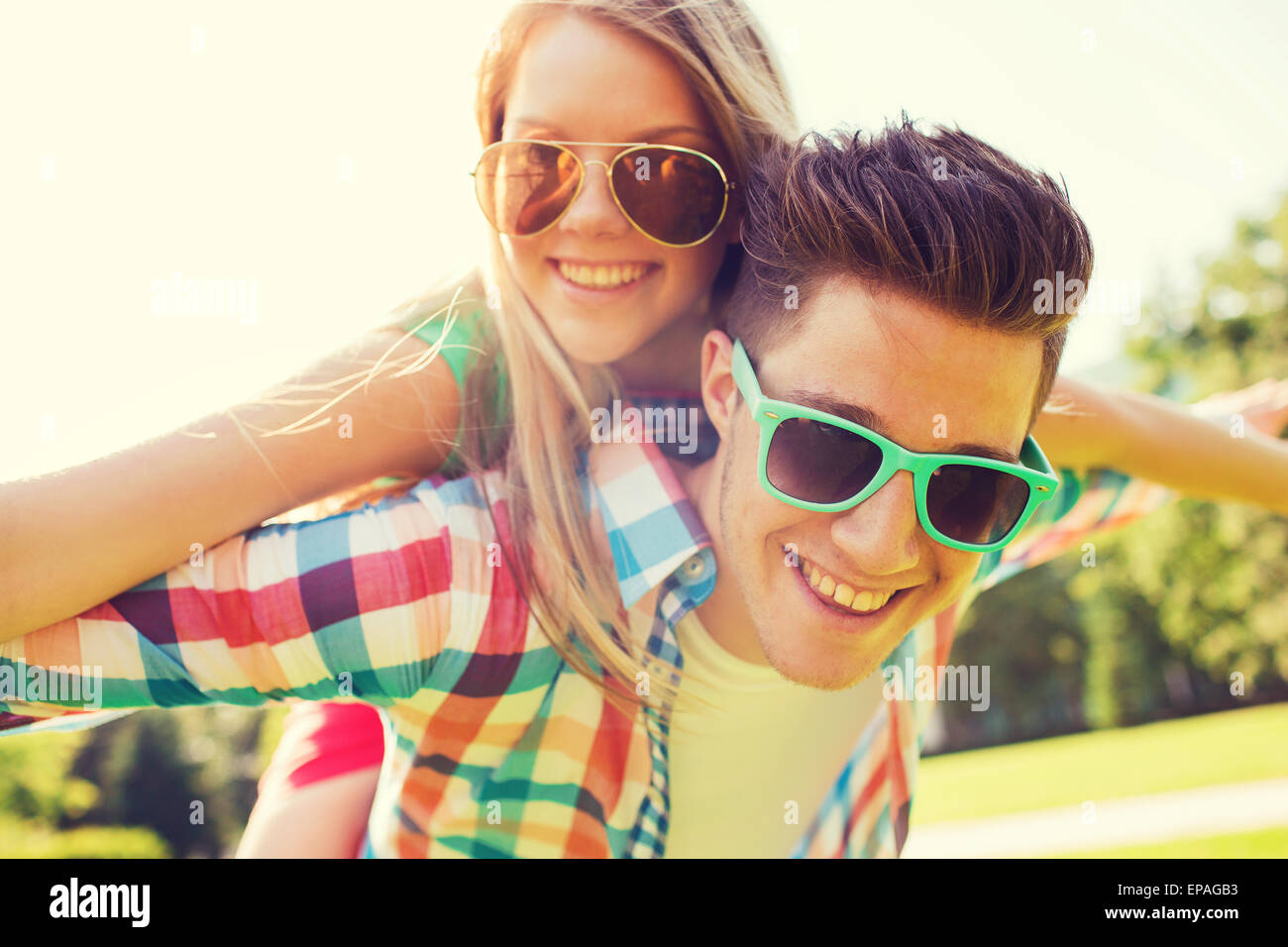 smiling couple having fun in park Stock Photo - Alamy
