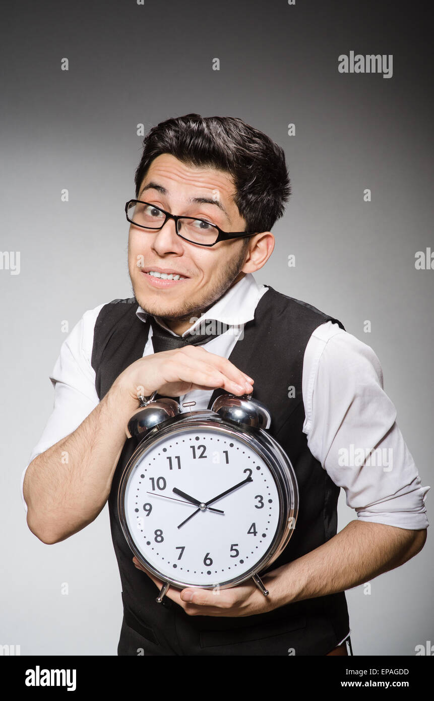 Businessman with clock in time concept Stock Photo - Alamy