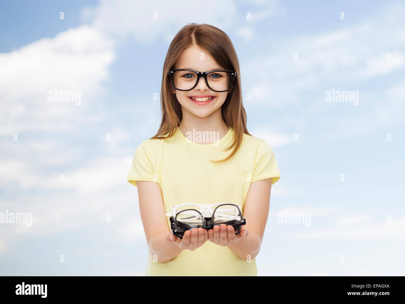 smiling cute little girl in black eyeglasses Stock Photo - Alamy
