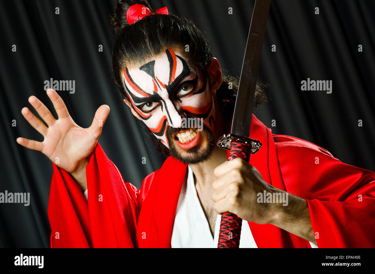Man with sword and face mask Stock Photo - Alamy