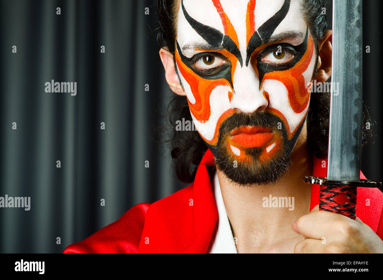 Man with sword and face mask Stock Photo - Alamy