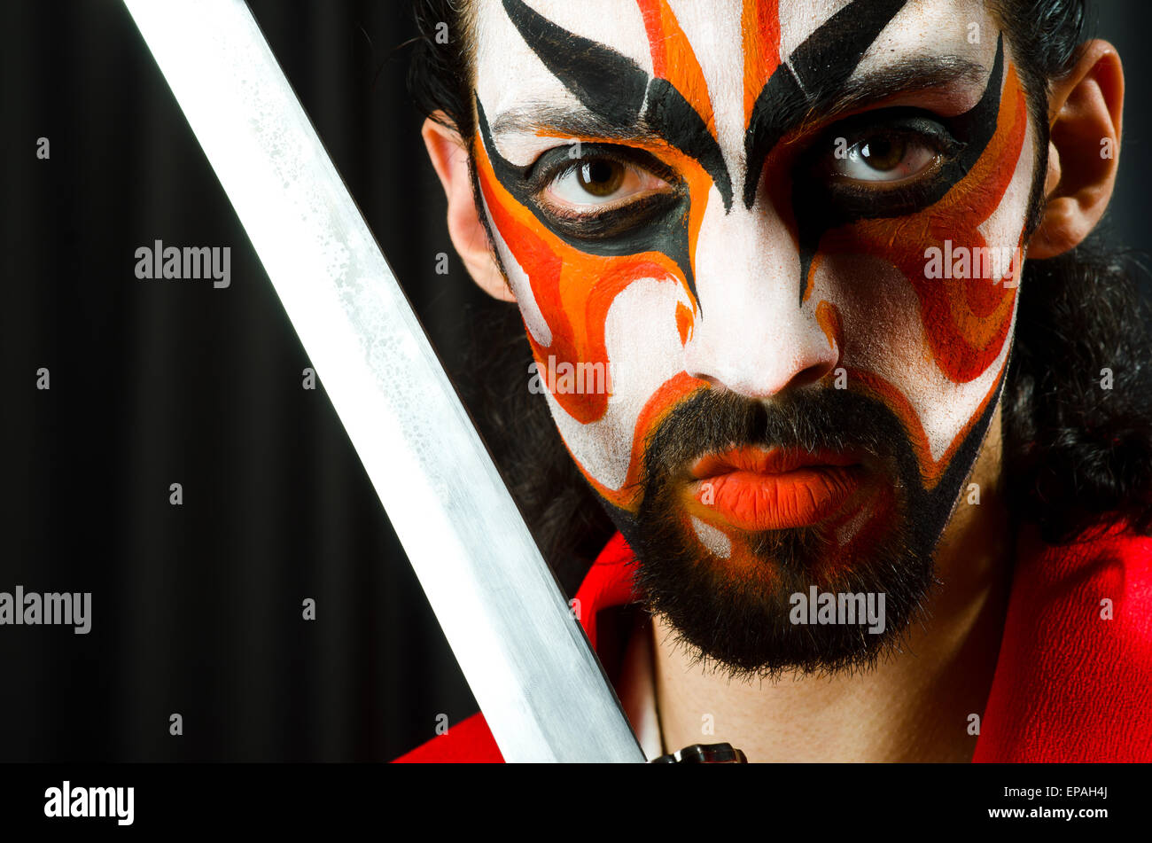Man with sword and face mask Stock Photo - Alamy