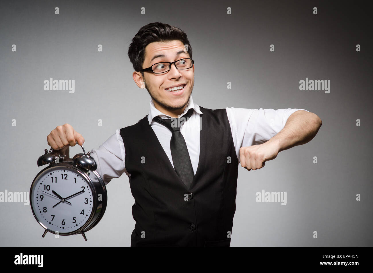 Businessman with clock in time concept Stock Photo - Alamy