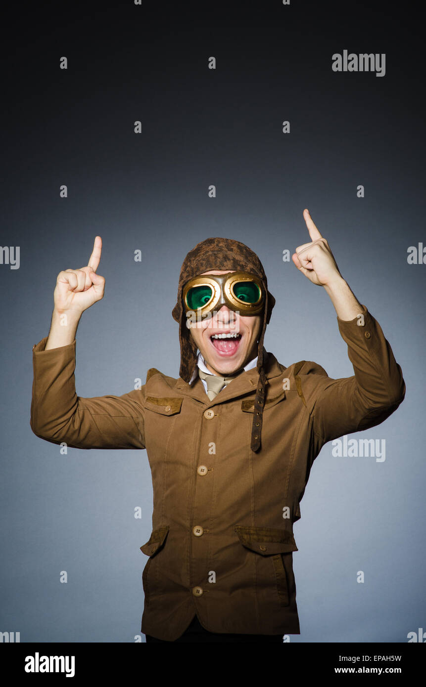 Funny pilot with goggles and helmet Stock Photo - Alamy