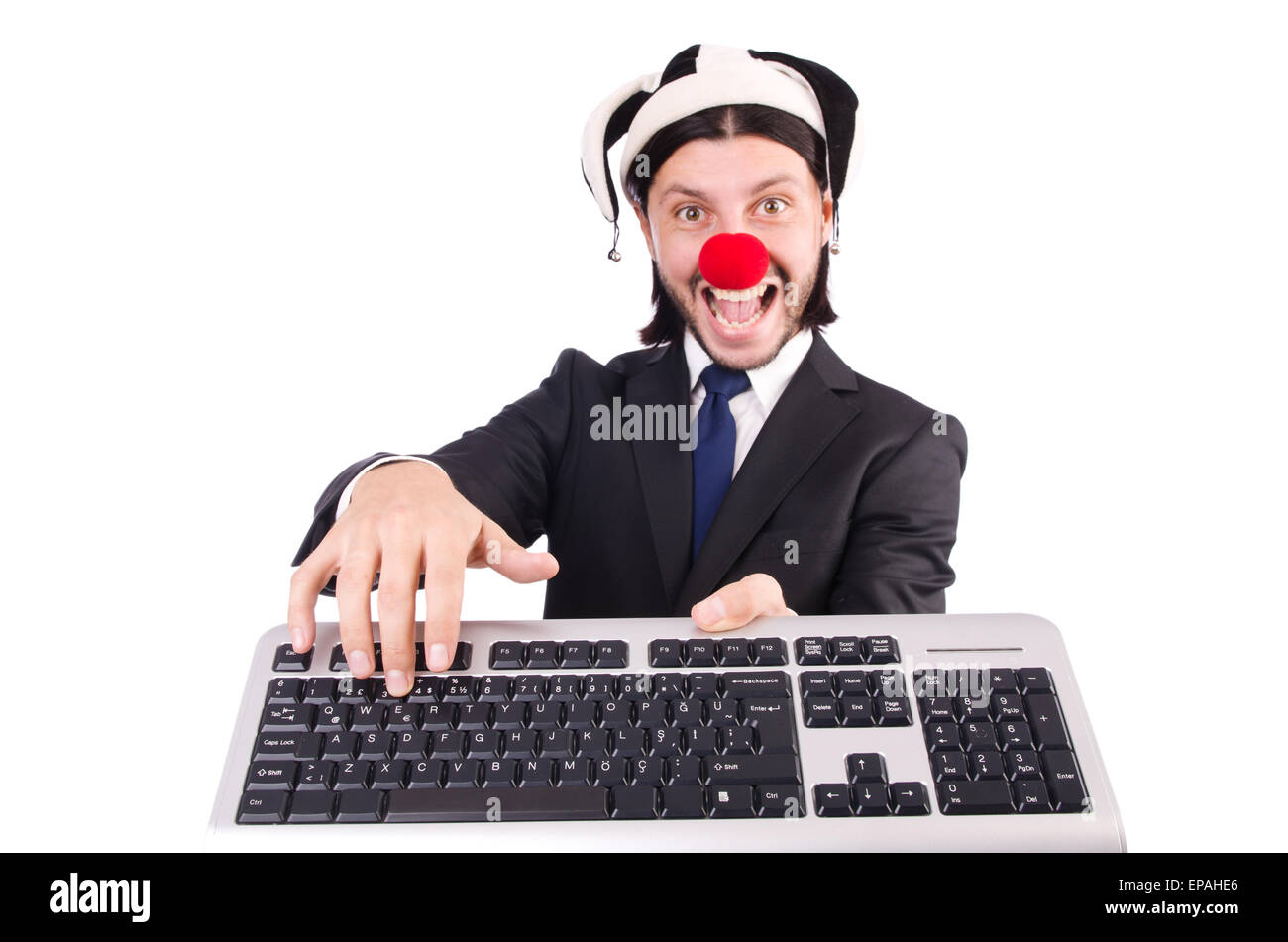 Funny clown with keyboard isolated on white Stock Photo - Alamy