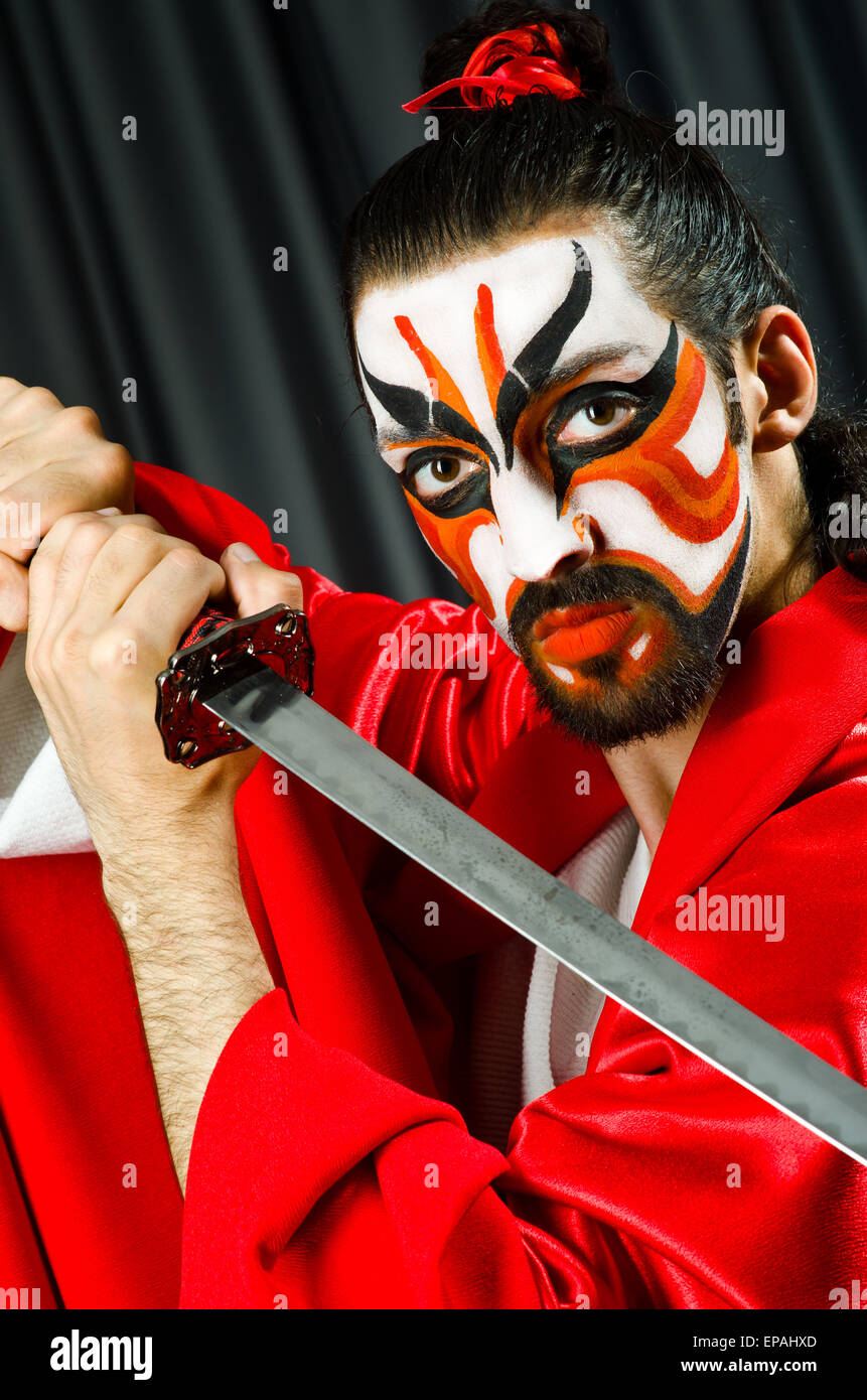 Man with sword and face mask Stock Photo - Alamy