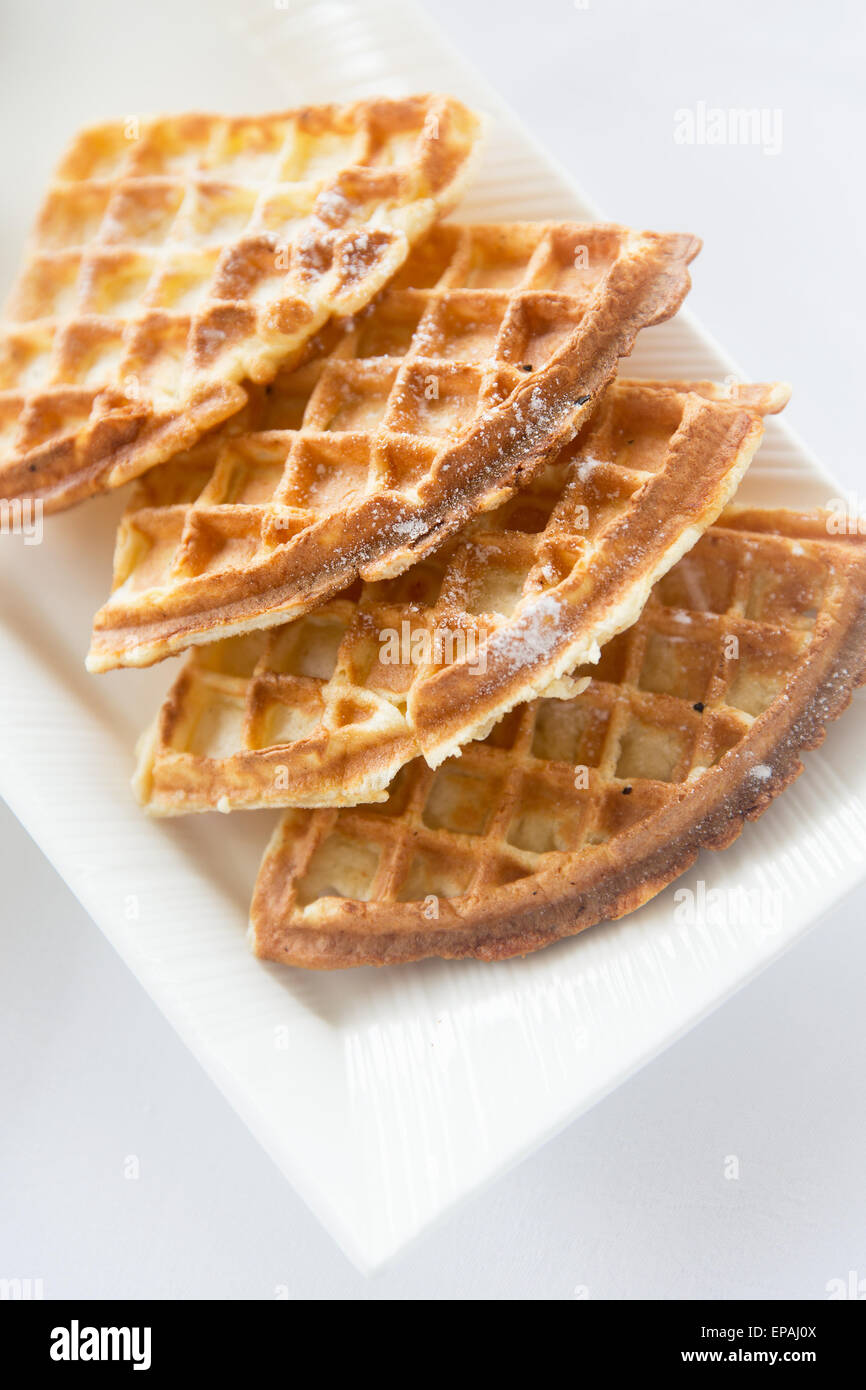 close up of waffles on plate at breakfast table Stock Photo - Alamy