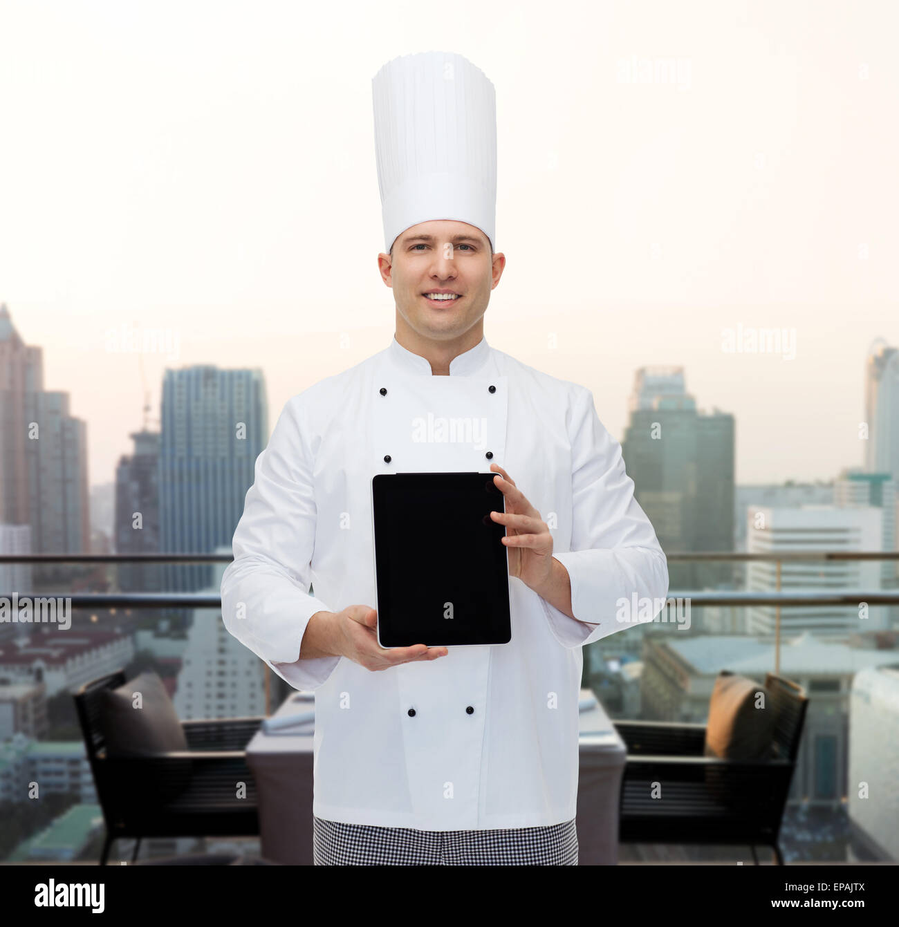 happy male chef cook showing with tablet pc Stock Photo - Alamy