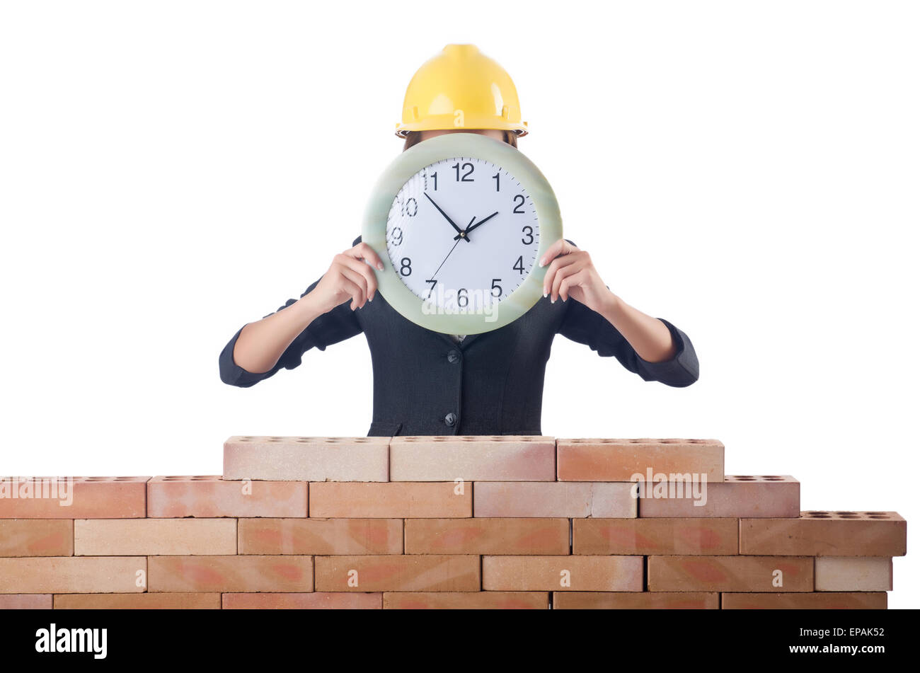 Woman construction worker with clock on white Stock Photo - Alamy
