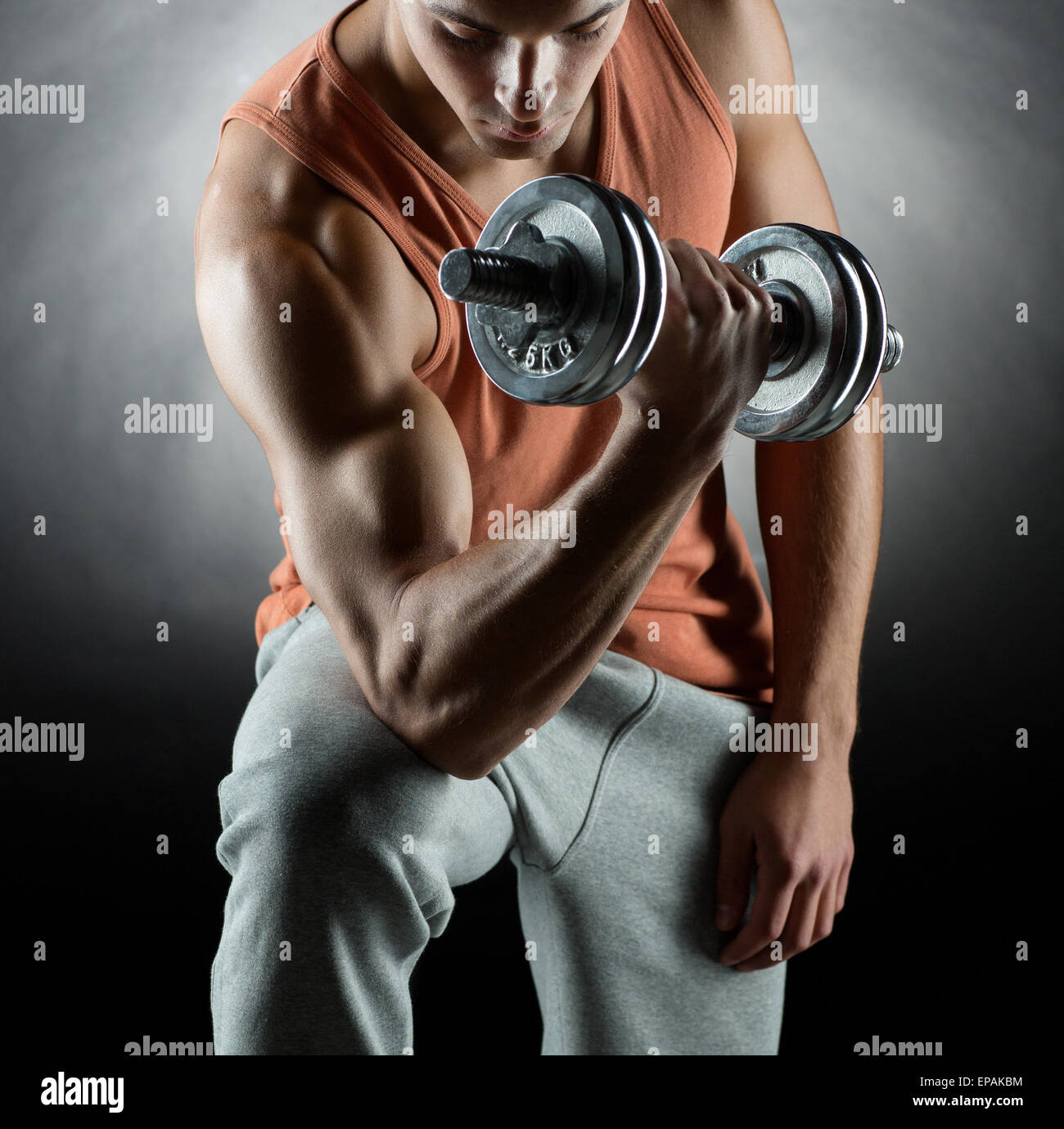 young man with dumbbell Stock Photo - Alamy