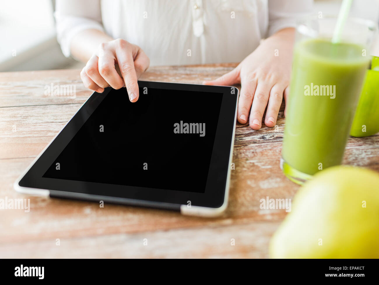 close up of woman hands tablet pc and fruit juice Stock Photo - Alamy